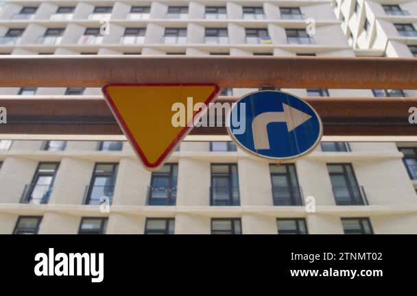 Two road signs on the building. Shot with RED helium camera in 8K Stock ...