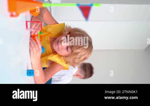 Children playing with toy car control panel in STEM educational class ...