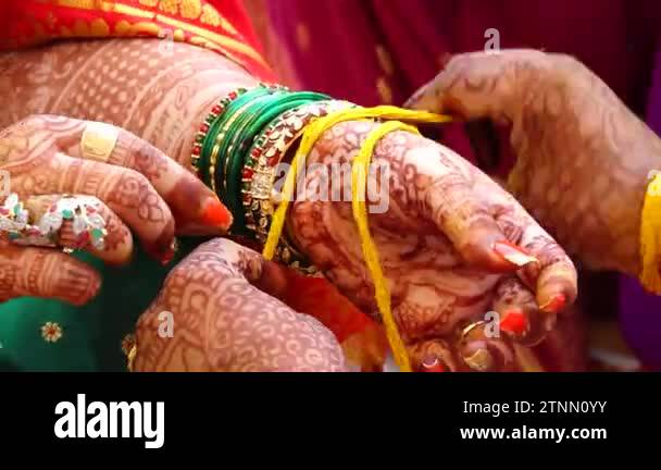 Ceremony of Wearing Turmeric Thread on hand of bride. Marathi Wedding ...
