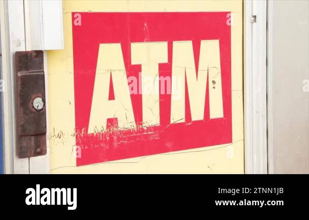atm sign capital letters writing text on store door in beige white ...