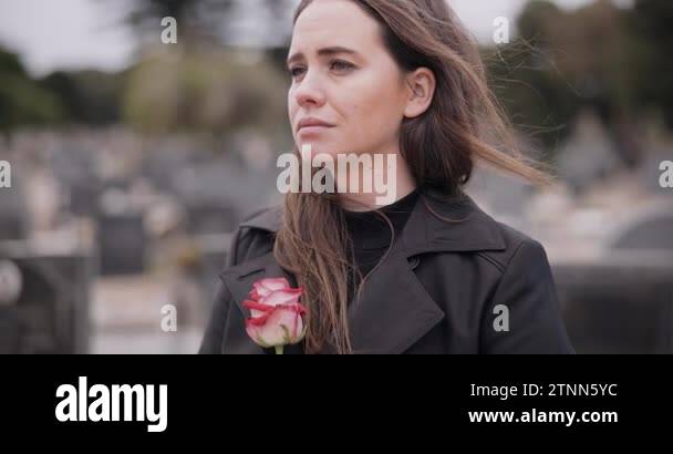 Rose, death or sad woman in graveyard for funeral. spiritual service or ...