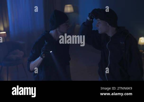 Video of two burglars, intruders, looking down at the owner, tenant of ...