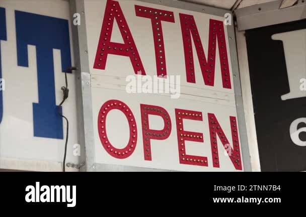 atm open flashing electronic sign with small light bulbs inside letters ...