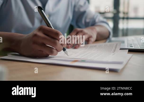 Close up unrecognizable man businessman writing paperwork report on ...