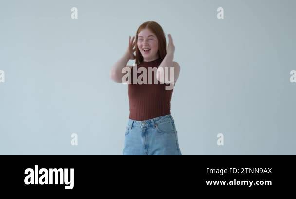 A happy teenage girl is shown expressing joy and exclaiming Wow on a ...