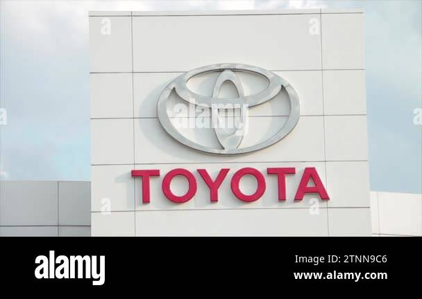 toyota logo sign on front of dealership outside exterior with birds ...