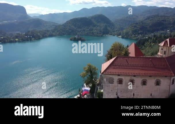 Aerial of Bled Castle or Blejski grad in Slovenia, with lake Bled in ...