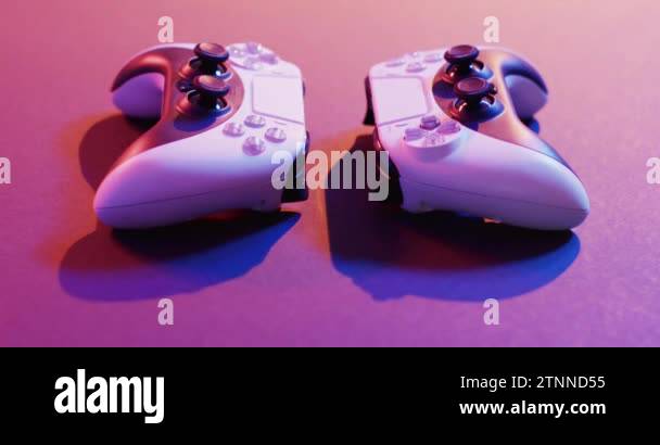 Video of close up of video game pad controllers with copy space on neon ...