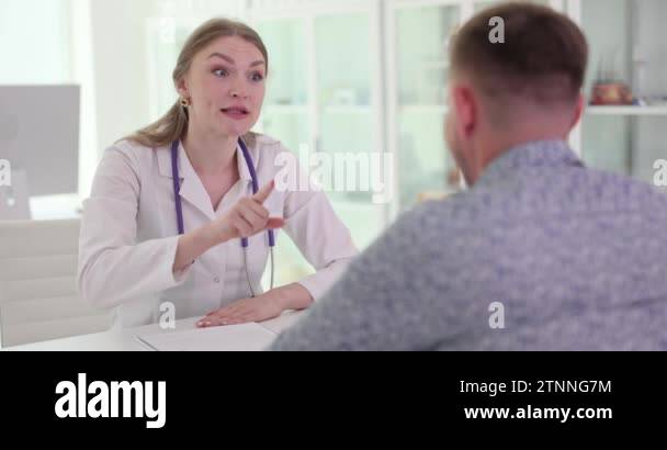 Angry physician kicks male patient out of exam room for inappropriate behaviour. Drunk male ...