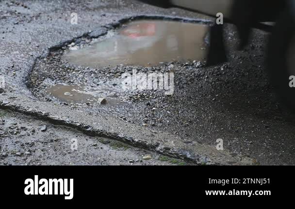 Potholes car Stock Videos & Footage - HD and 4K Video Clips - Alamy