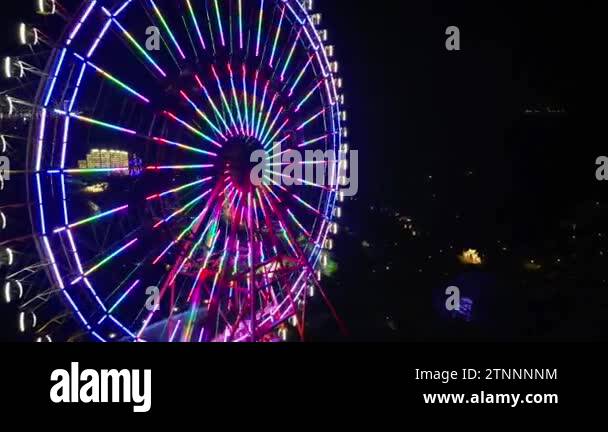 Top view aerial of ferris wheel in amusement park at night. Ferris ...