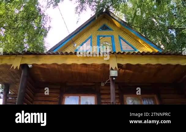 Fisherman's house on a tiny island in the middle of the lake on summer. Old Solotvyn village ...