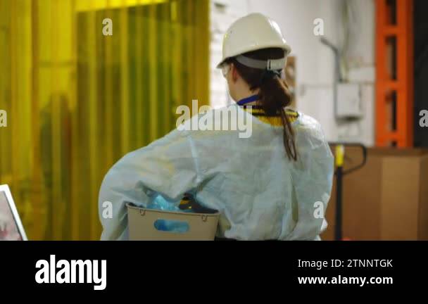Live camera follows confident woman in uniform walking on recycling ...