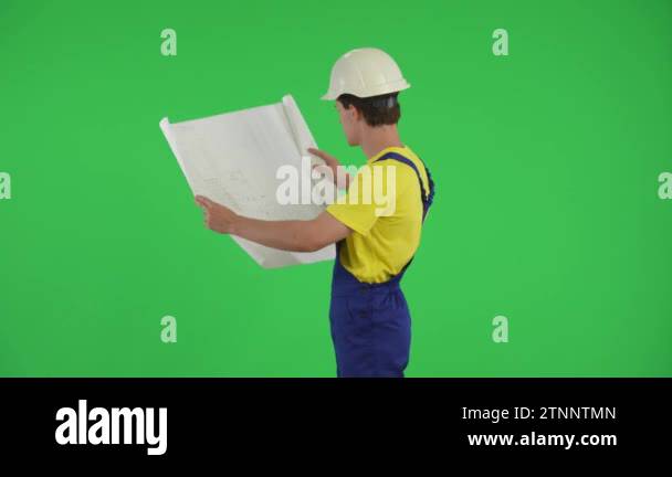 Medium green screen isolated chroma key video of a young construction ...