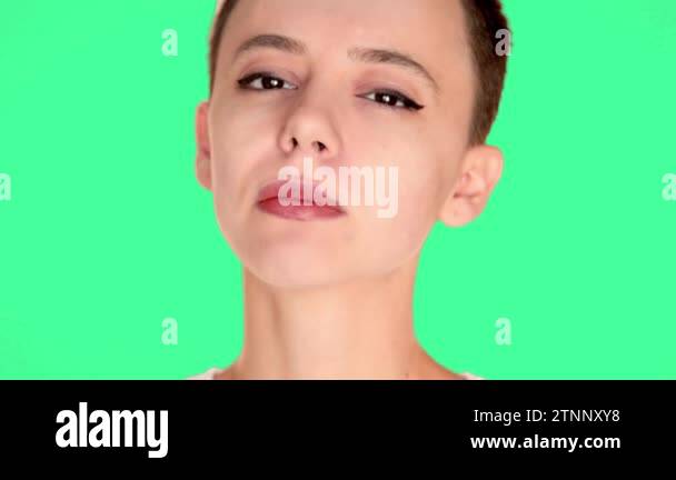 Beautiful bald girl, a girl with short hair brunette on the green ...