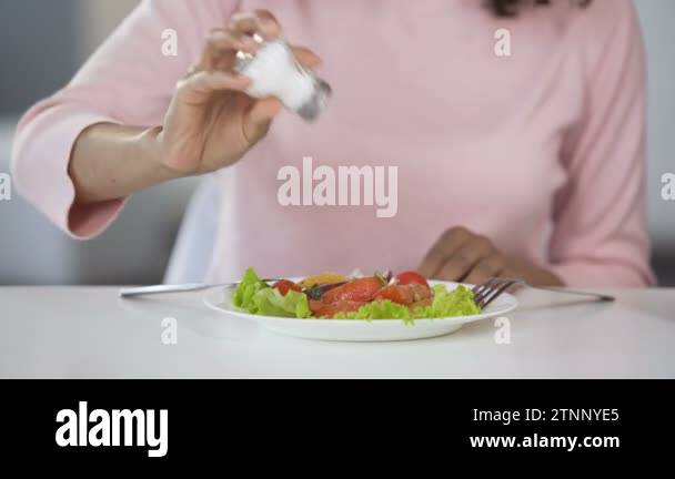 Woman adding salt to food Stock Videos & Footage - HD and 4K Video ...