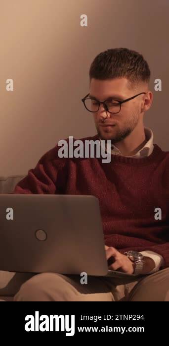 Vertical video. Distance work. Smart casual man. Computer technology ...