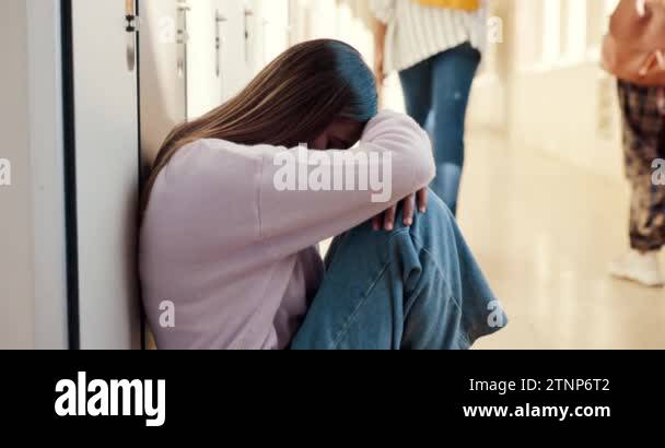 Sad, depression and student on floor in college hallway with anxiety ...