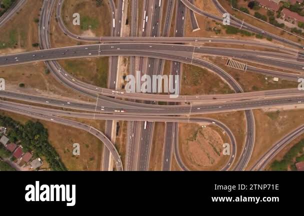 Top down aerial of cars drive across the expressway road in Canada ...