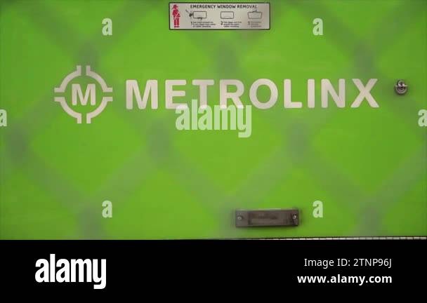 metrolinx logo in white writing on side of green go train parked at ...
