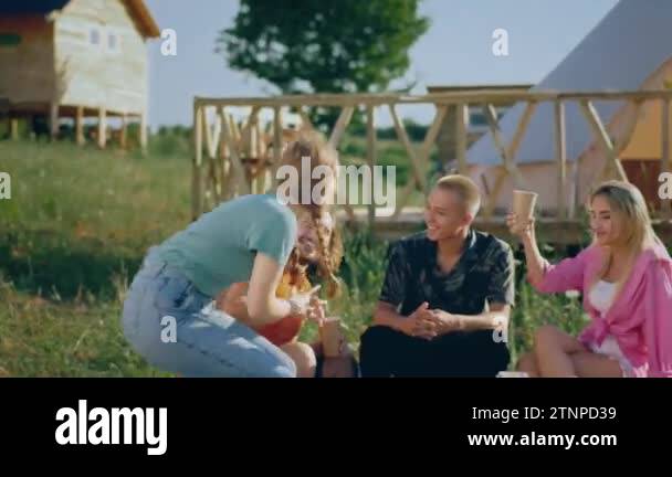 In the morning group of friends meeting all together at campsite they ...