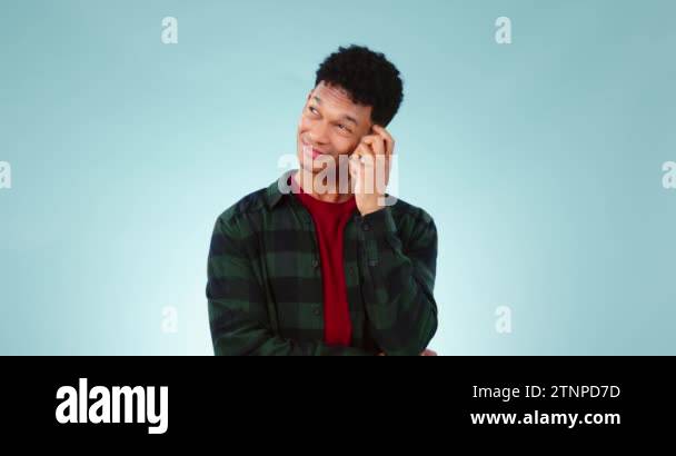 Thinking, brainstorming and young man in a studio with dreaming, guess ...