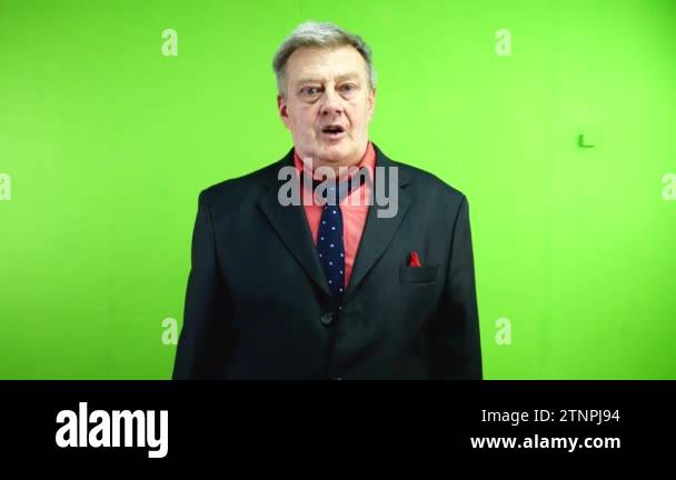 Senior newscaster journalist or speaker presenting news. Local newsreader speaks in TV studio ...