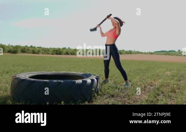 Outdoor Session Powerful Woman Engaging in Strength Exercise, Hitting ...