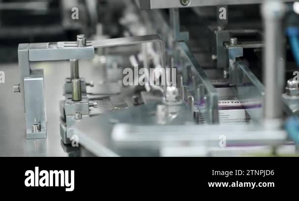 Packaged goods at automated production line. Packaging of drug. Medical ...