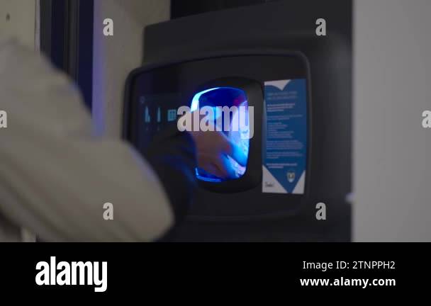 Man returns plastic bottles in the supermarket vending machine. Male ...