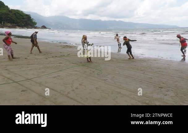 Native fisher woman fishing on sea, using traditional technique pulling ...