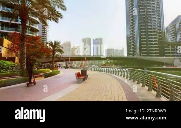 Dubai marina area, city walk, marina walk, promenade with yacht. High ...