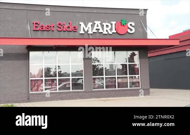 east side marios restaurant front logo sign above facade and windows ...