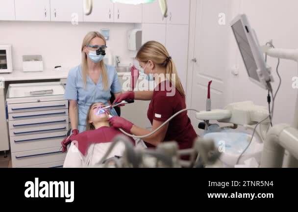 Modern dentistry, Clinic room, Patient teeth. Stomatologist uses ...