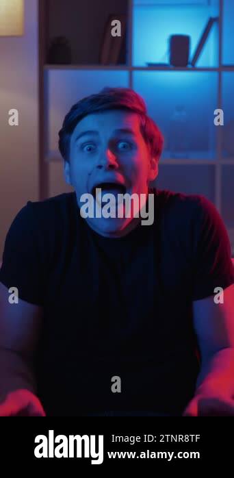 Vertical video. Grimacing man. Meme expression. Silly behavior. Foolish ...