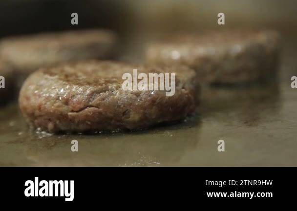 Meat Patty - Close Up Cooking Beef Paties On The Griddle - Side Angle ...