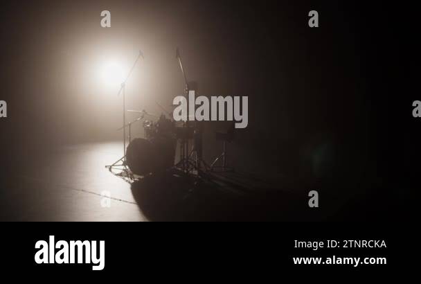 Full length of young male drummer in cap enjoying music while playing ...