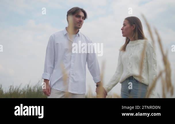 Portrait of confident man breaking up with woman leaving as sad ...