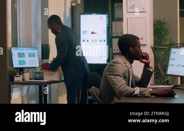 Coworker consolling employee leaving workplace after deciding to quit ...