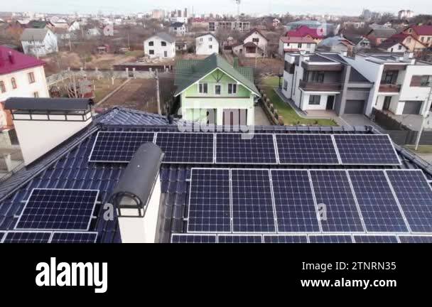 Video footage of photovoltaic solar panels on roof of house in urban ...