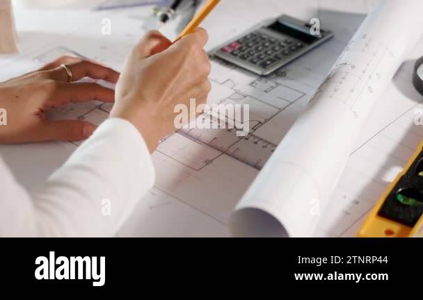 Architectural project workplace. Architect drawing with ruler on house ...