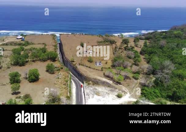 A drone flies above the Pandawa Beach area, capturing the expanse of ...