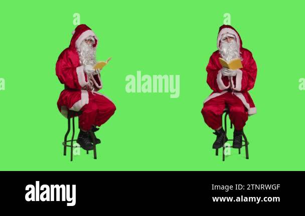 Saint nick reading novel story on chair, using book for lecture hobby ...