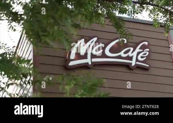 mccafe mcdonalds logo on side of restaurant building brown wall with ...