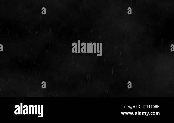Heavy rain wall falling in front of the camera against black screen ...