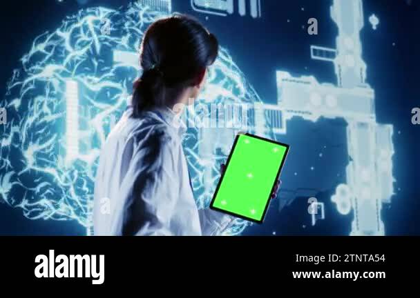 Tech savvy IT practitioner using green screen tablet to implement ... Tech savvy IT practitioner using green screen tablet to implement ...