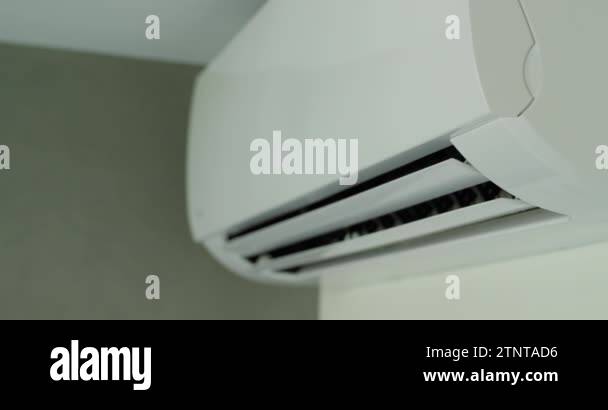 Air conditioner operation, flow louvers move up and down, distributing ...