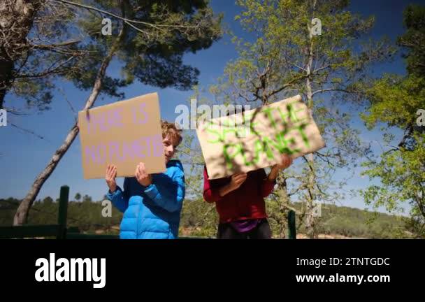 volunteer kids with Save the planet Poster. boy child activist holding ...
