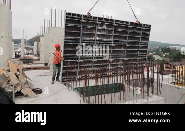 Installation of a large metal structure on the roof of the building ...