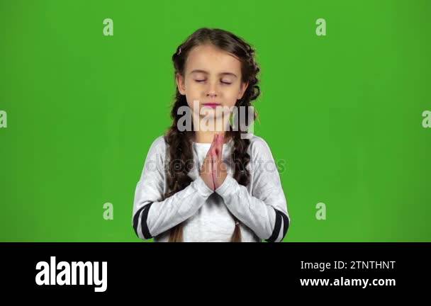 Baby crosses his fingers in his arms. Green screen. Slow motion Stock ...